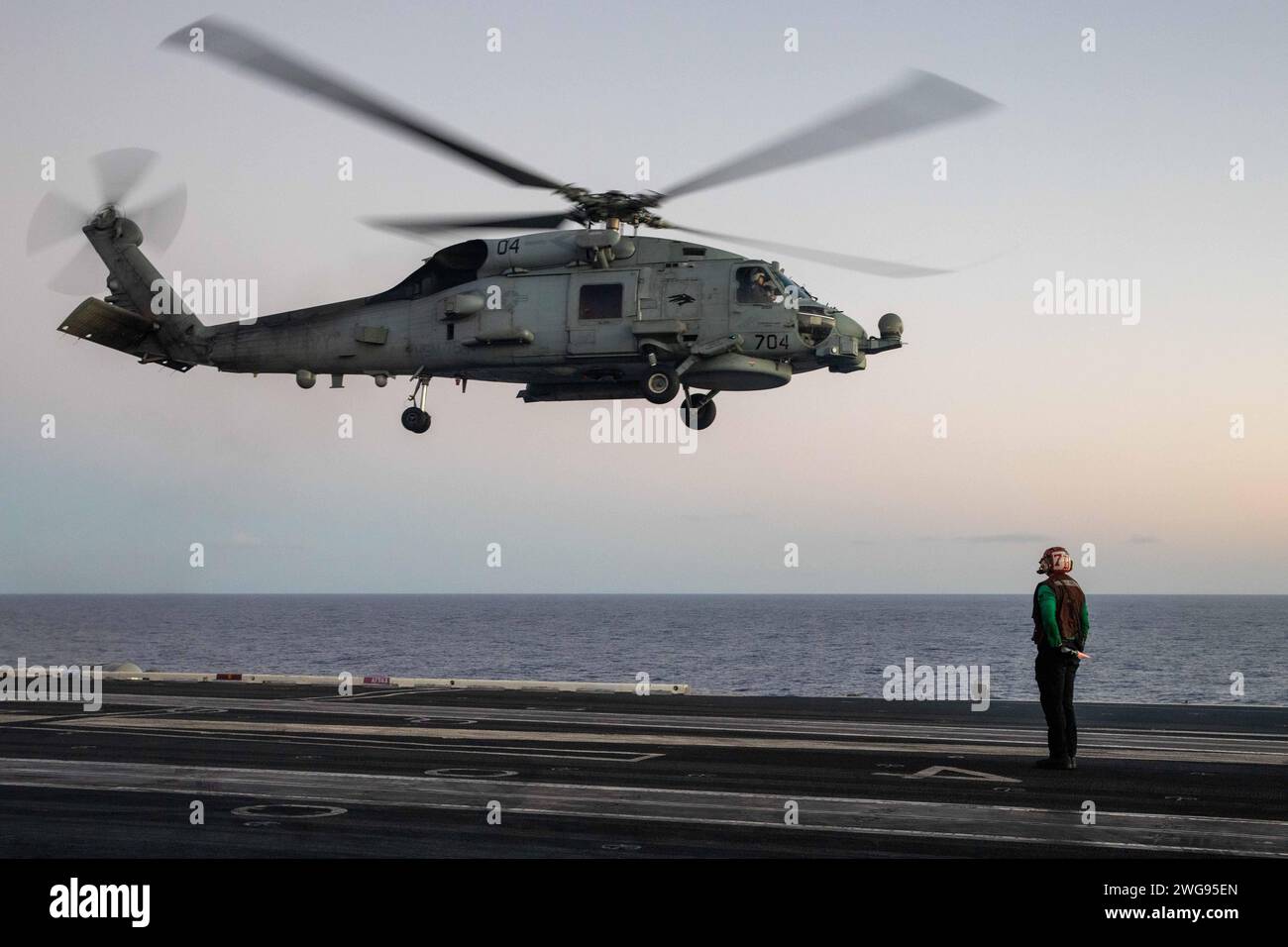 PHILIPPINE SEA (Feb. 2, 2024) An MH-60R Sea Hawk, assigned to the “Wolf ...