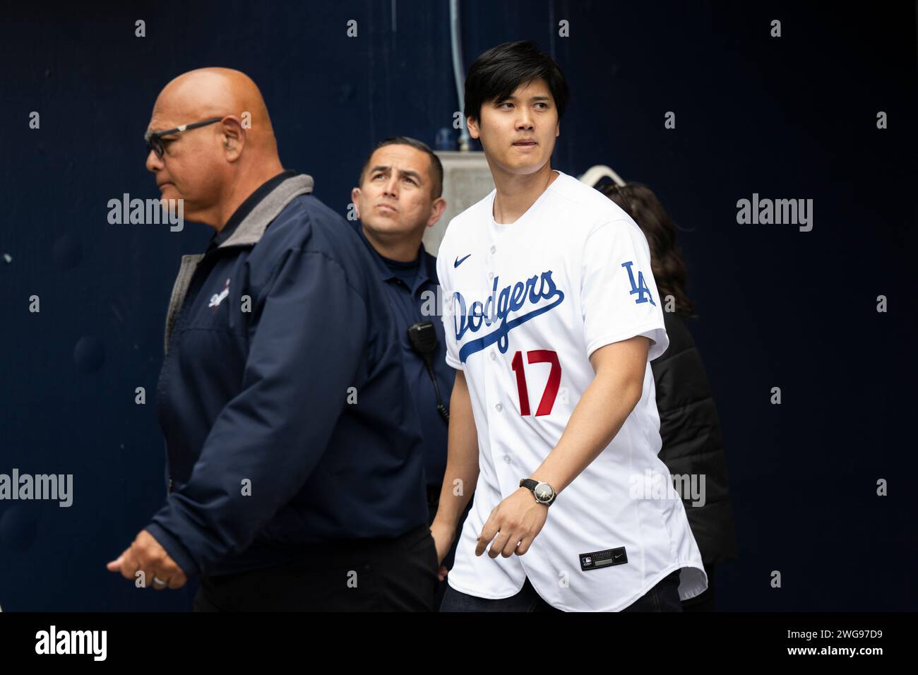 Los Angeles Dodgers' Shohei Ohtani walks to the stage during the team's ...
