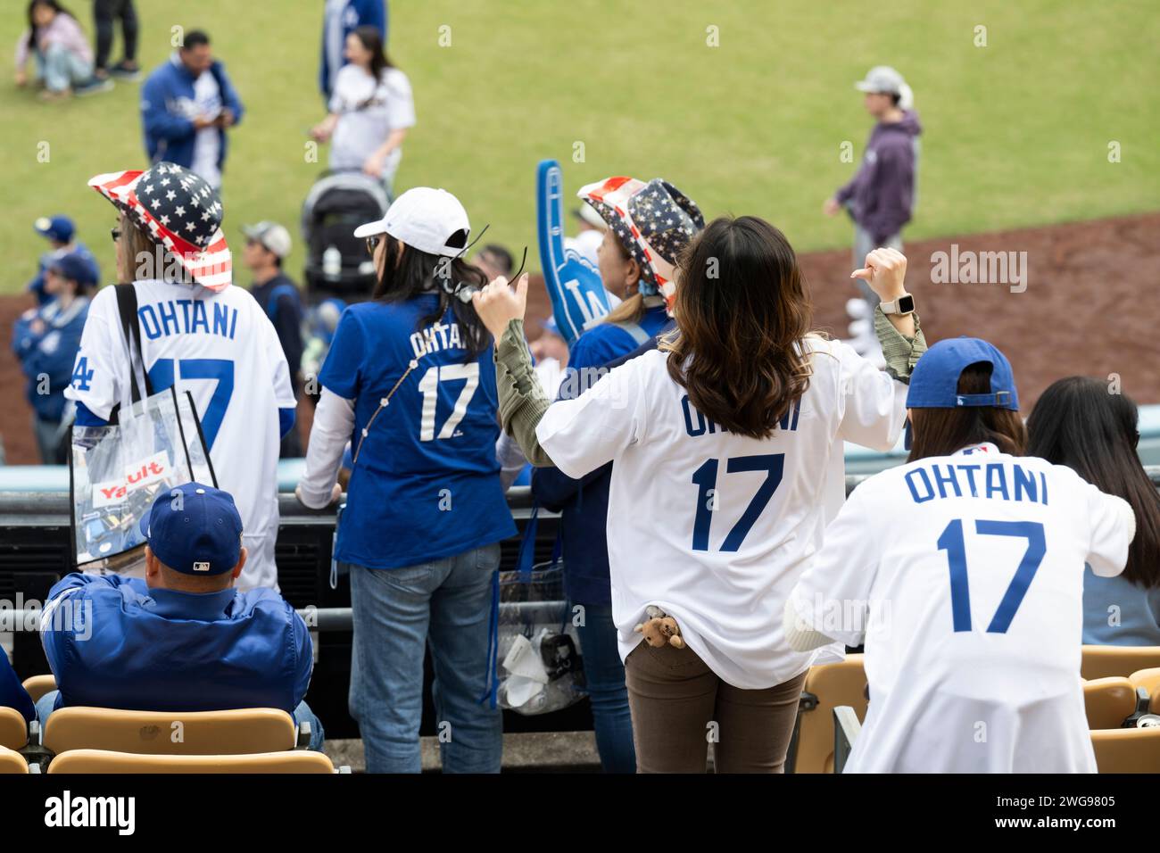Fans with Shohei Ohtani merchandise attend the Los Angeles Dodgers fan ...