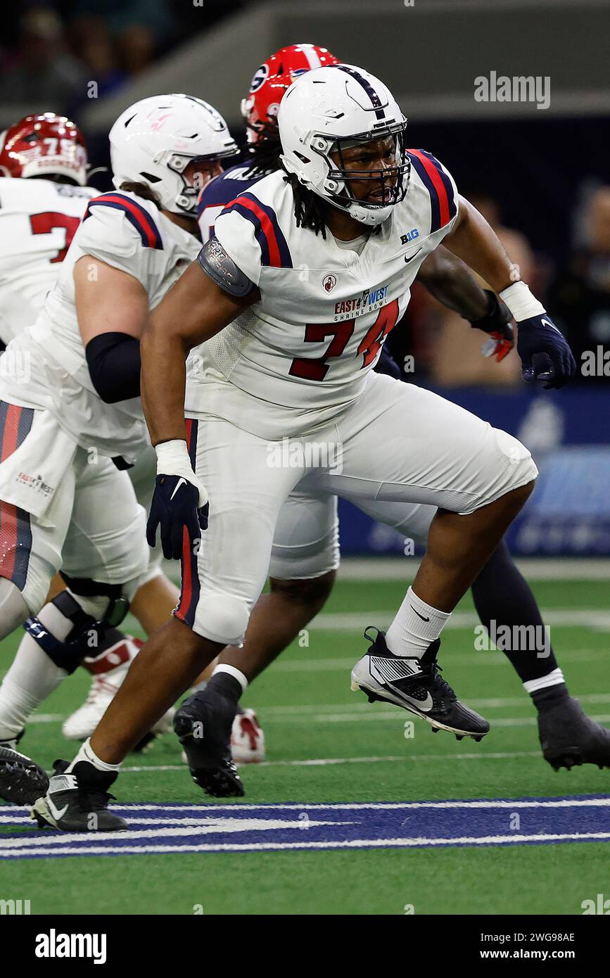 East offensive tackle Caedan Wallace (74) of Penn State moves to block ...