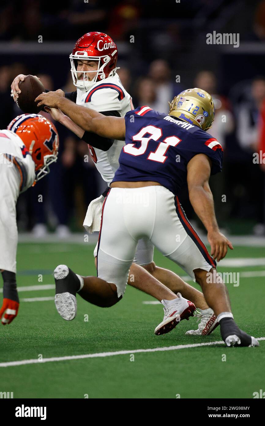 West defensive end Grayson Murphy (91) of UCLA sacks East quarterback ...