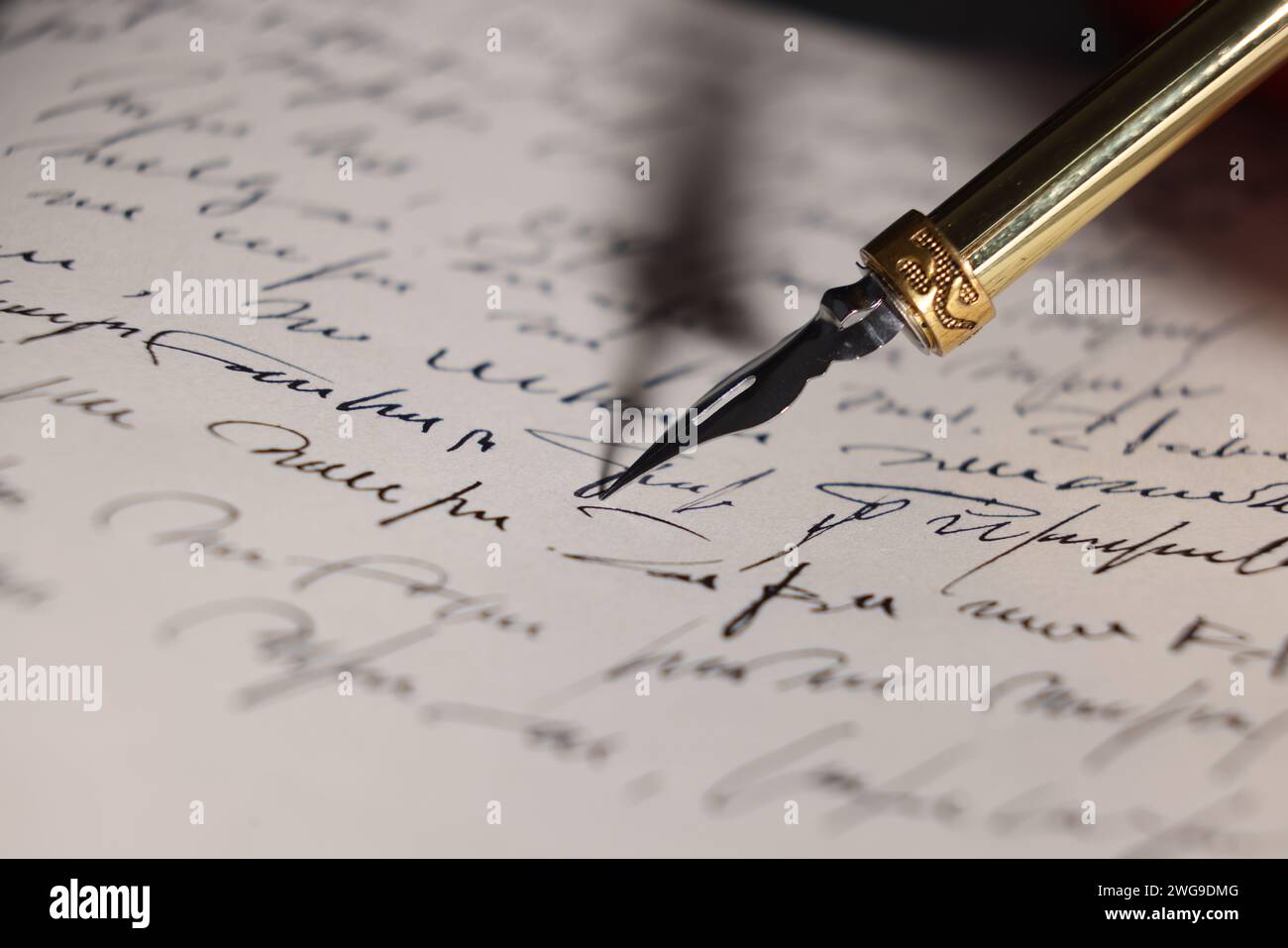 Writing letter with elegant fountain pen, closeup Stock Photo - Alamy