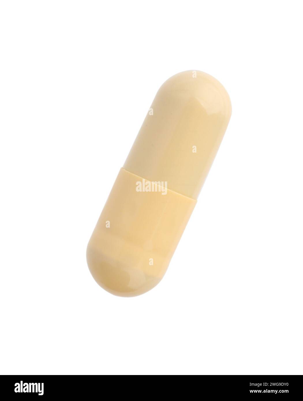 One vitamin capsule isolated on white, top view Stock Photo - Alamy