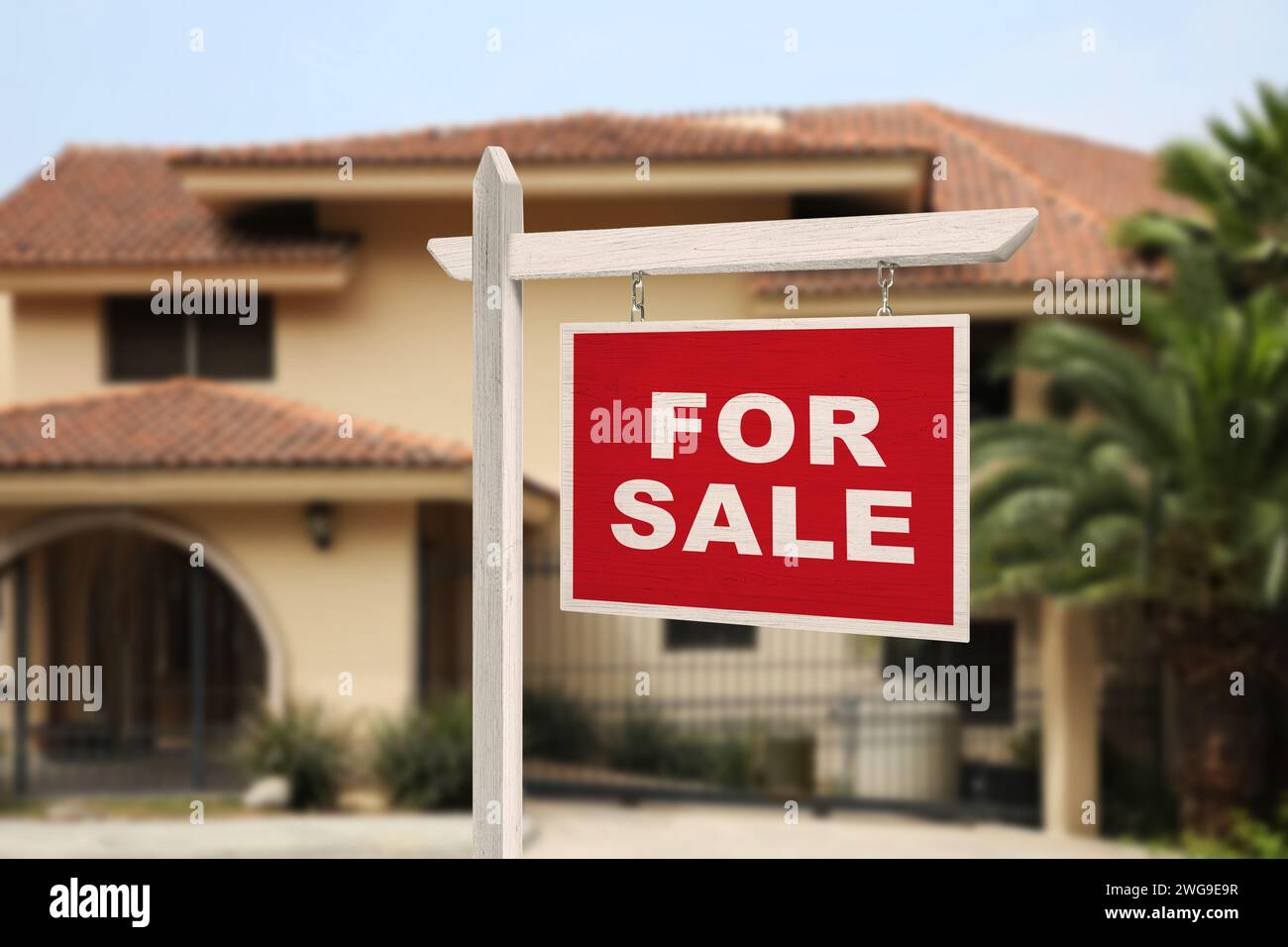 Sale sign near beautiful house outdoors. Red signboard with words Stock ...