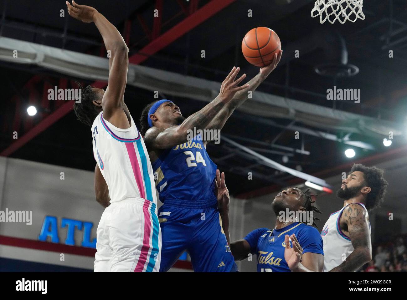 Tulsa guard Cobe Williams (24) drives to the basket as Florida Atlantic ...