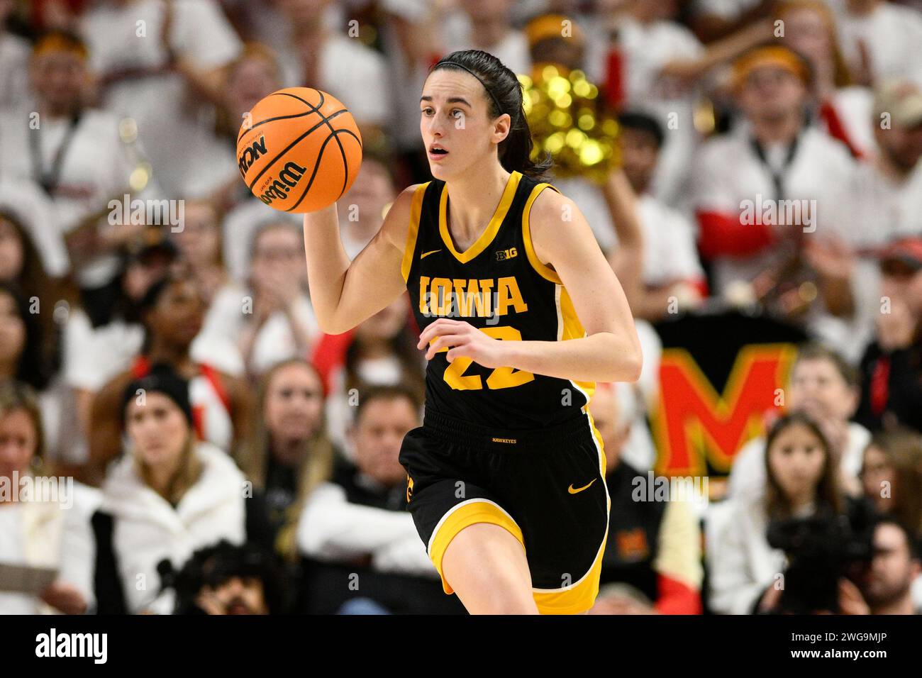 Iowa guard Caitlin Clark dribbles during the first half of an NCAA ...