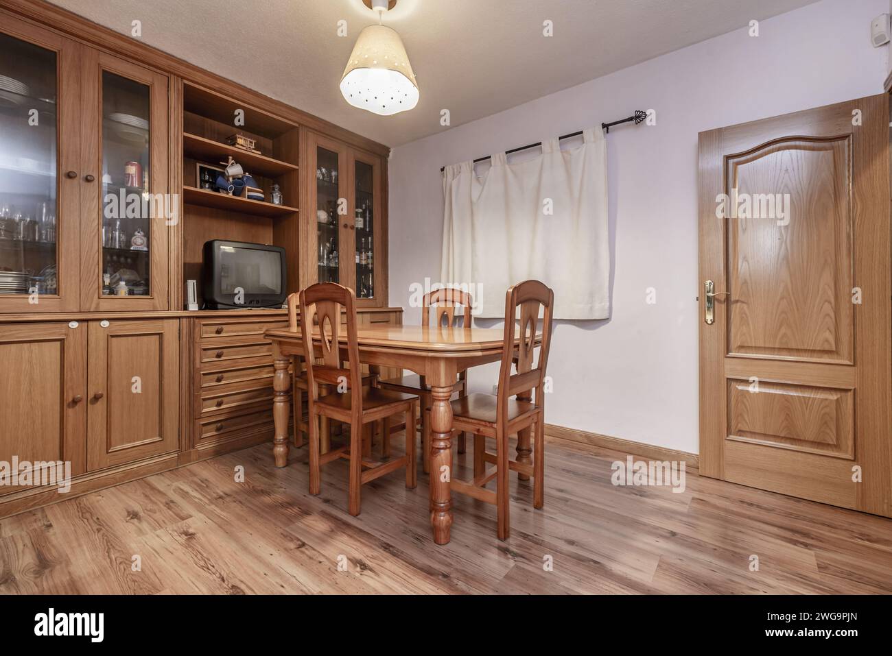 Small dining room in a home with matching table and chairs, wooden ...