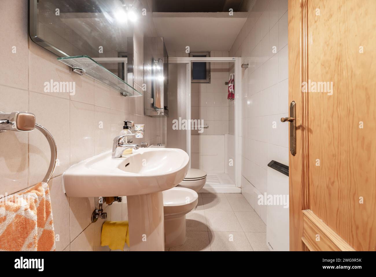 Bathroom without furniture, shower cabin in the back, white toilets ...