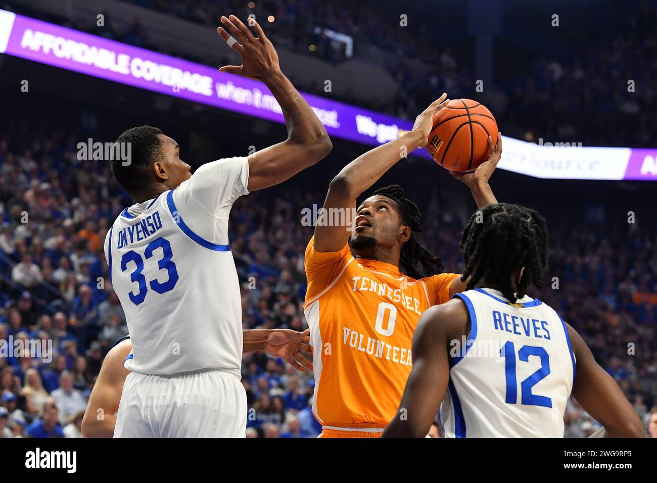 Tennessee forward Jonas Aidoo (0) attempts a shot over Kentucky forward ...