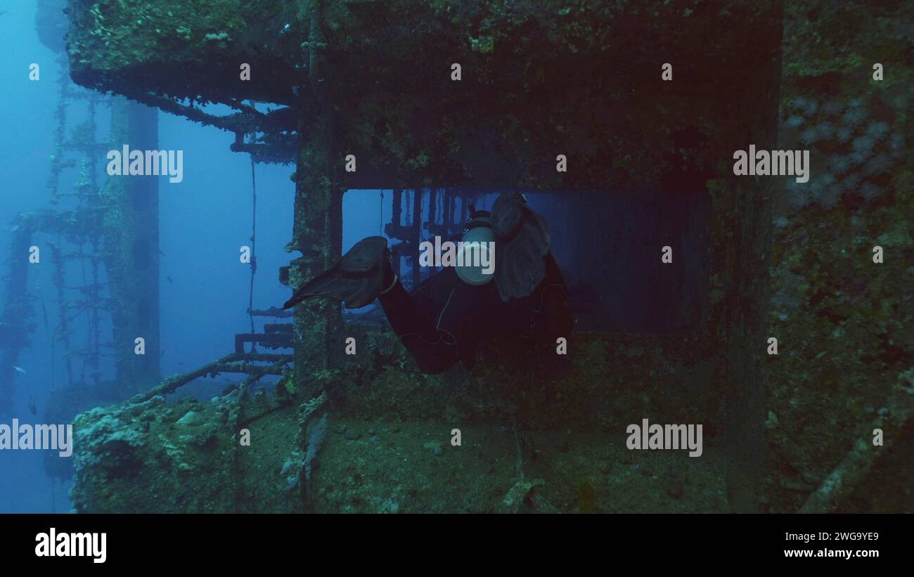 Scuba diver swim down corridor of ferry Salem Express shipwreck, Red ...