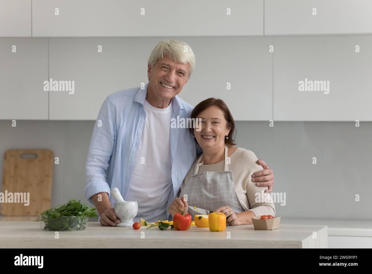 Happy senior retired family couple home portrait Stock Photo - Alamy
