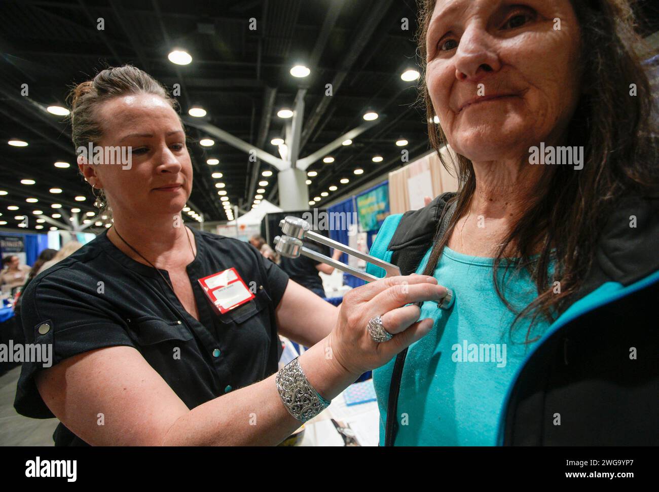 Vancouver, Canada. 3rd Feb, 2024. A woman tries a tuning fork therapy ...