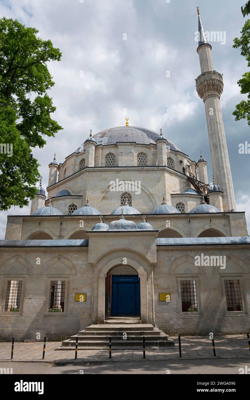 View of a mosque with a large dome and a high minaret surrounded by trees, Tombul Mosque, Sherif ...
