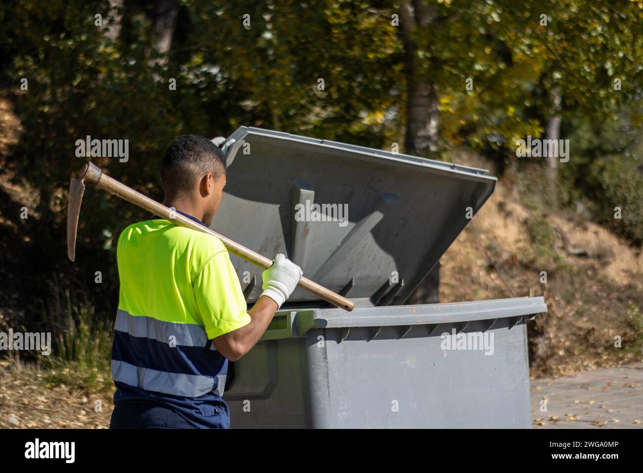 Rear view of a man throwing garbage hi-res stock photography and images - Alamy