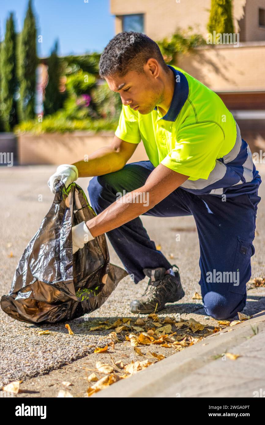 Hispanic collecting trash hi-res stock photography and images - Alamy