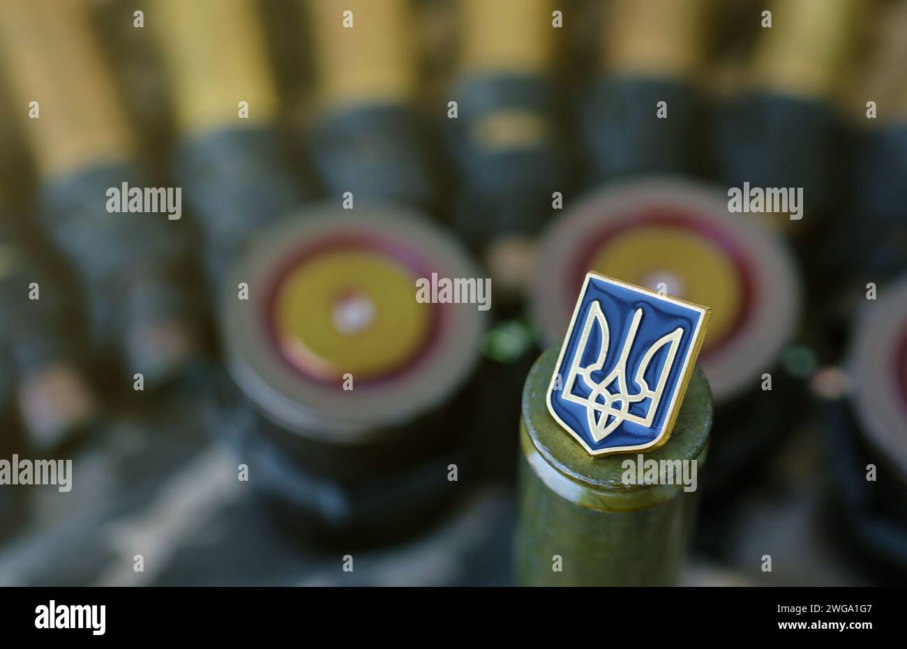 Ukrainian symbol on machine gun belt lies on ukrainian pixeled military ...