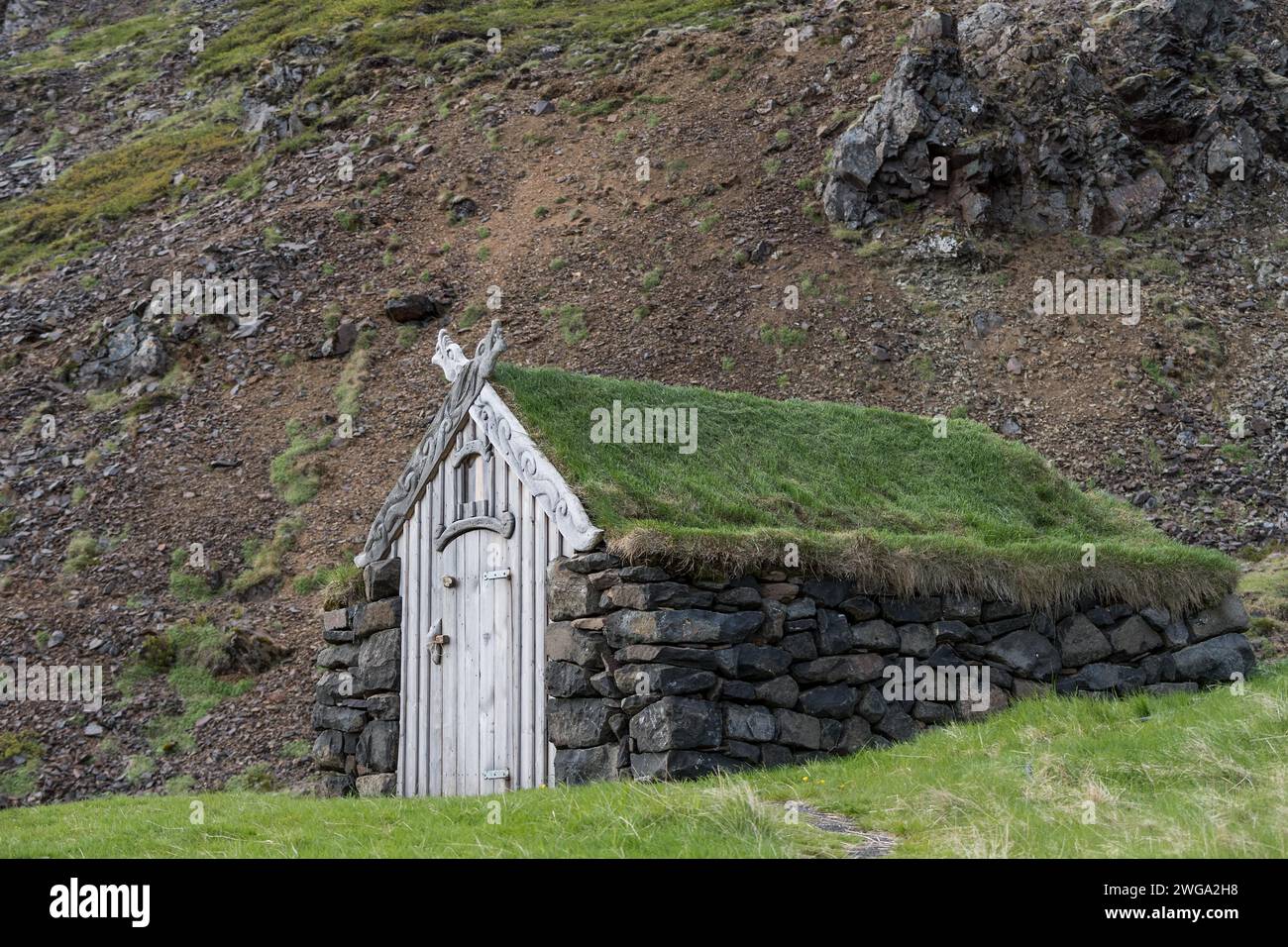 Old hut with stone walls and grass roof, Laugar, Westfjords, Iceland ...