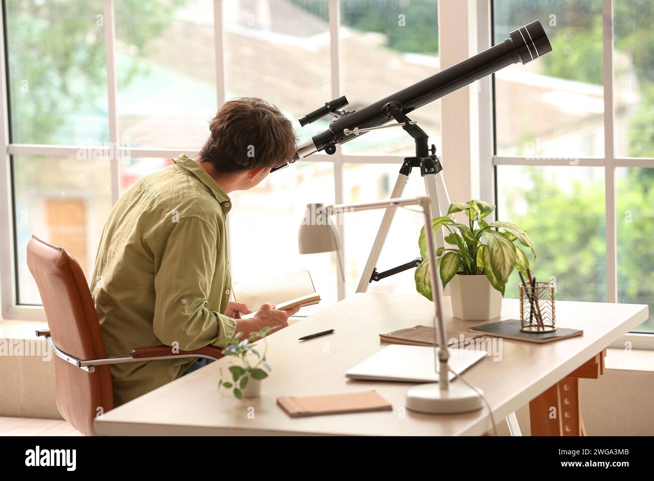 Person using telescope astronomy hi-res stock photography and images ...