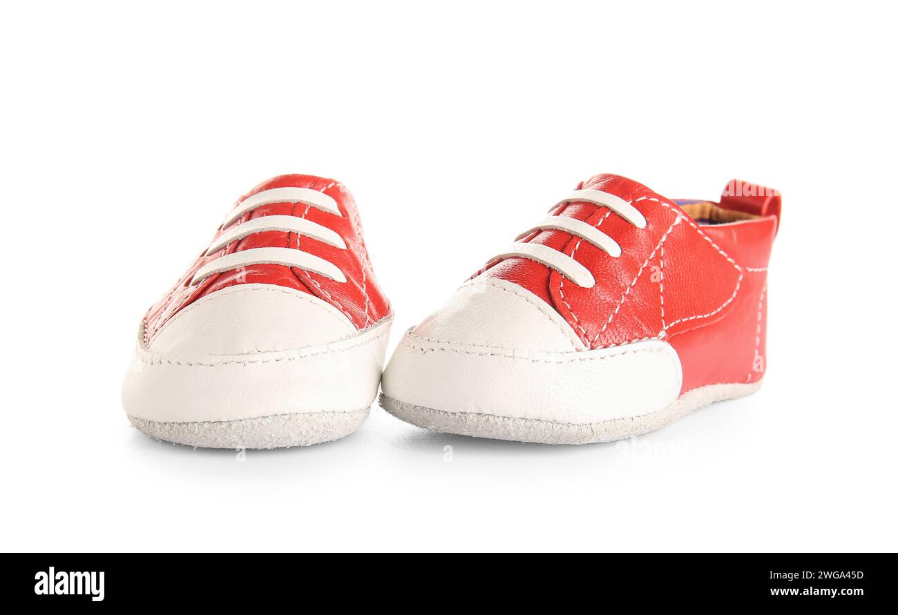 Stylish red baby shoes isolated on white background Stock Photo - Alamy