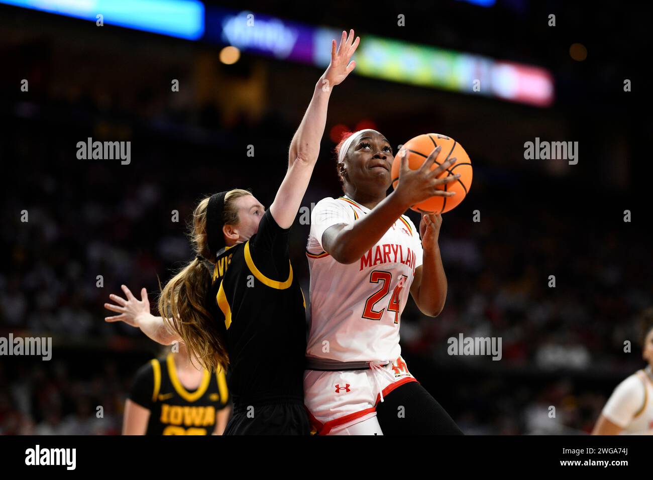 Maryland guard Bri McDaniel (24) goes to the basket against Iowa guard ...