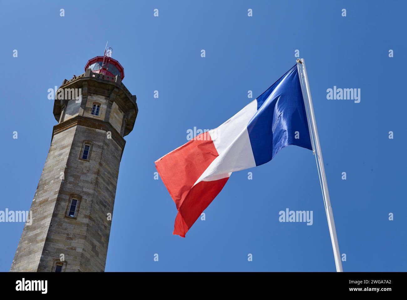 Spire of the Phare des Baleines and a waving French flag in Saint ...