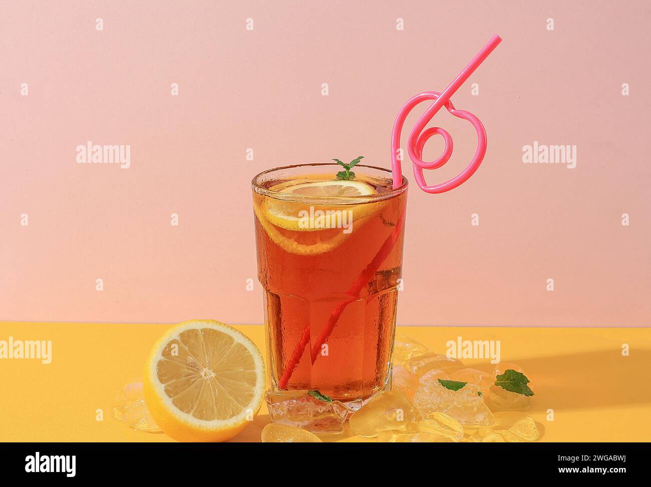 Iced Lemon Tea with Heart Shape Straw. Es Lemon Tea on Pink and Yellow ...