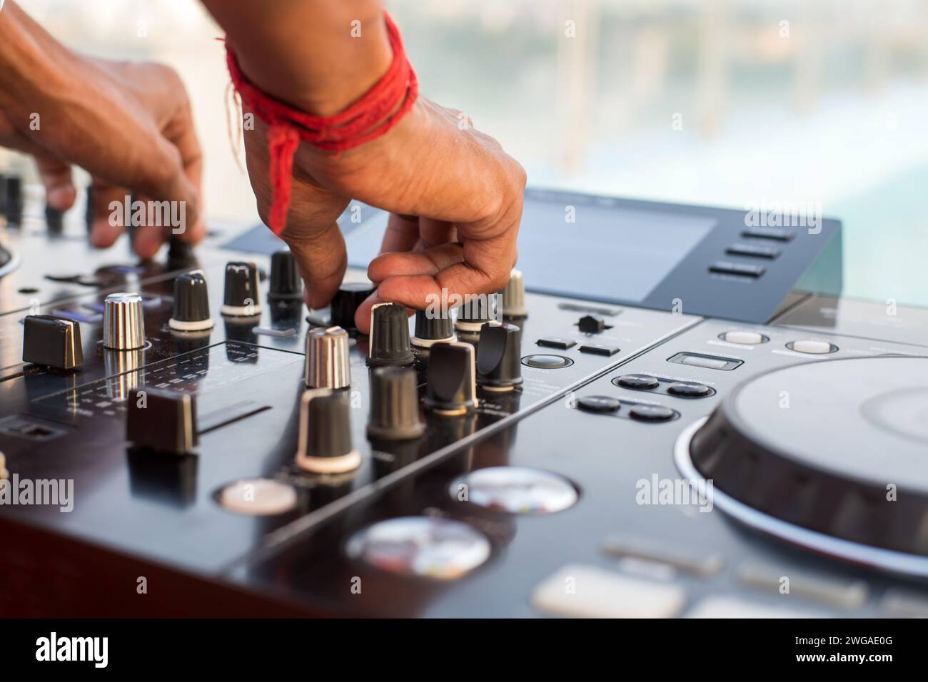 Close-up of a dj operating Sound mixer on a table Stock Photo - Alamy