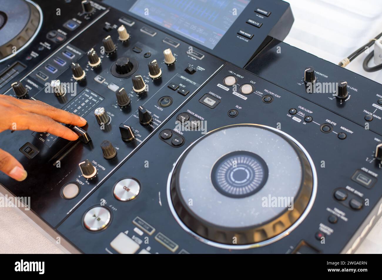 Close-up of a dj operating Sound mixer on a table Stock Photo - Alamy