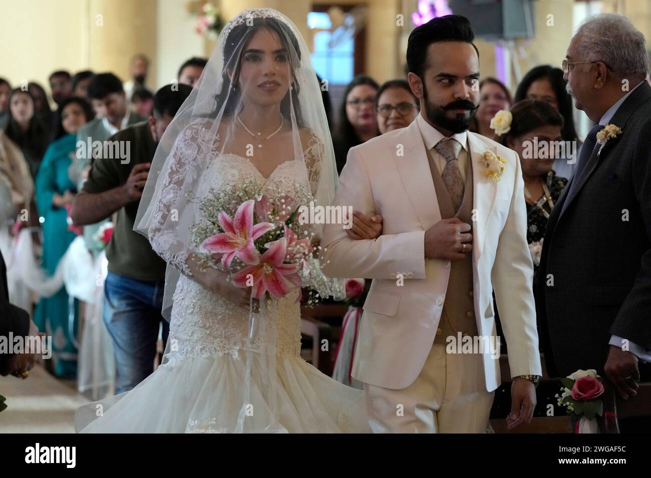 Pakistani Christian groom Sharoon Arjumand John arrives with his bride ...