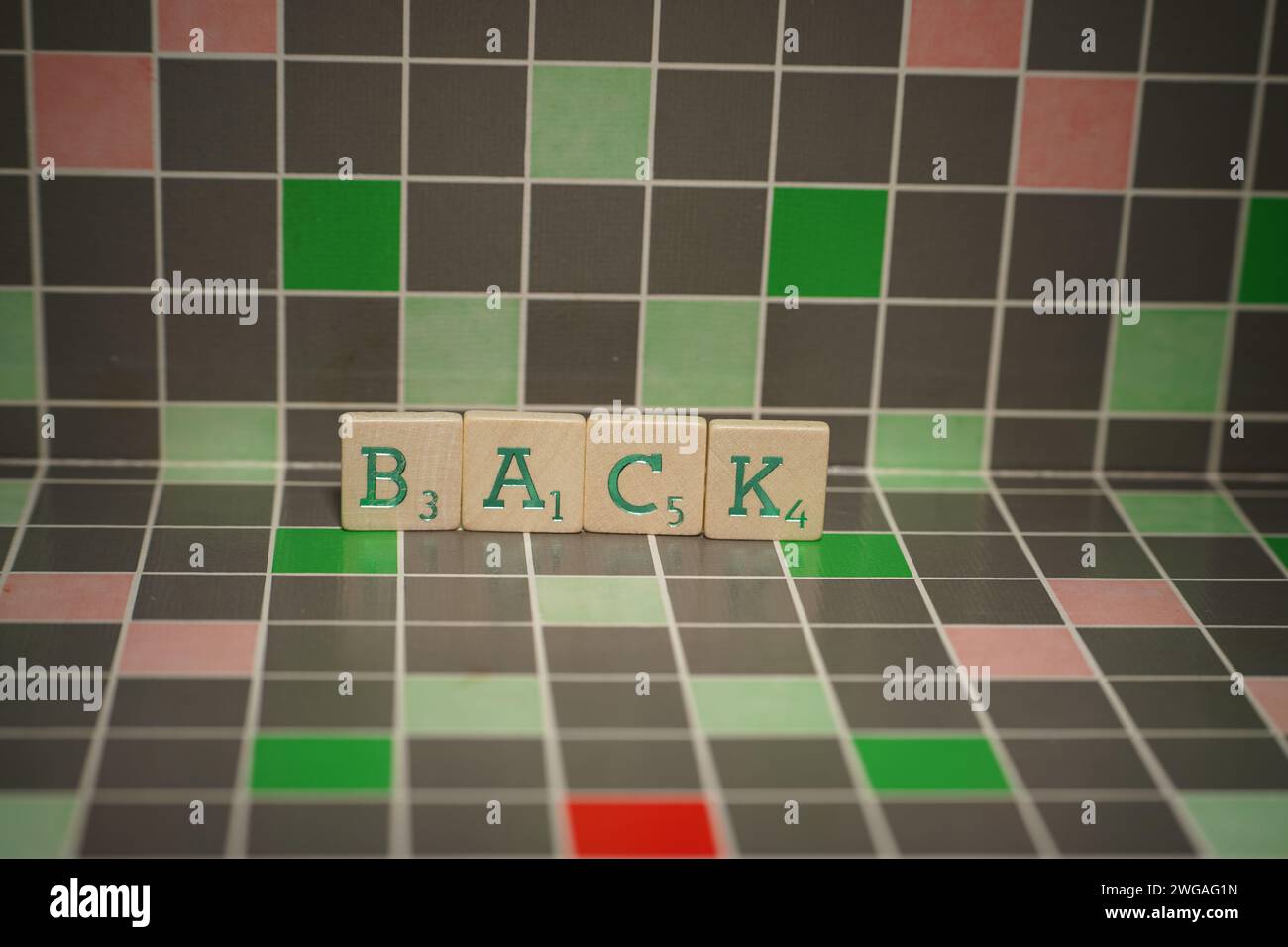 Wooden tile with green back text on a blocked background Stock Photo ...