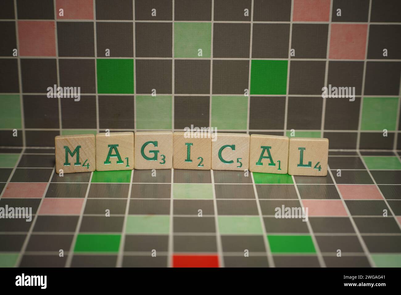 Wooden tile with green magical text on a blocked background Stock Photo ...