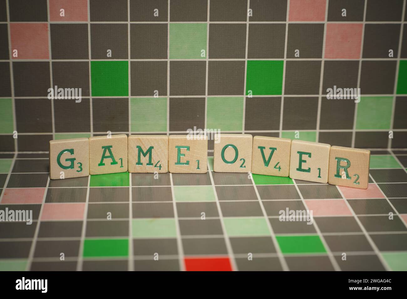 Wooden tile with green game over text on a blocked background Stock ...