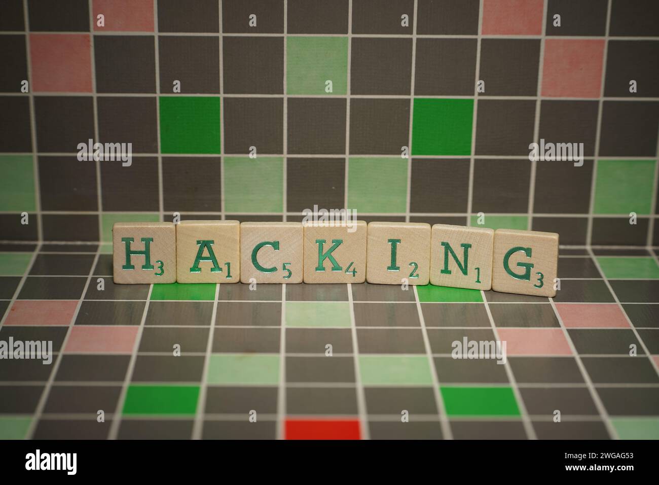 Wooden tile with green hacking text on a blocked background Stock Photo ...