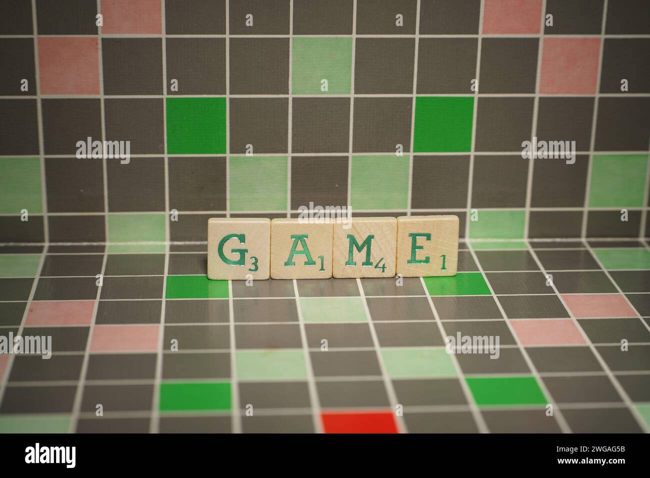 Wooden tile with green game text on a blocked background Stock Photo ...