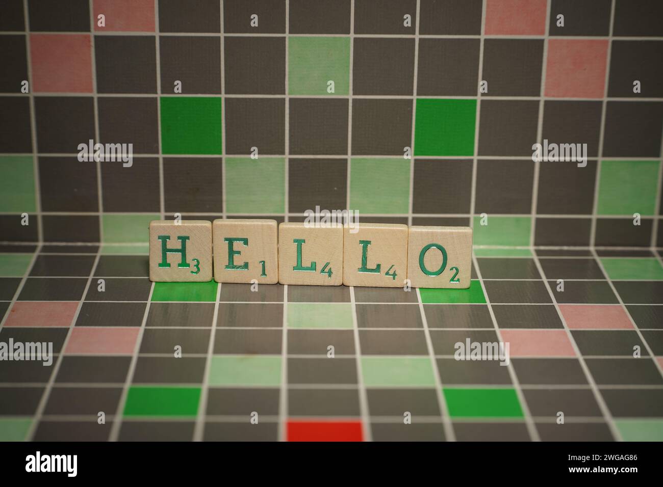 Wooden tile with green hello text on a blocked background Stock Photo ...