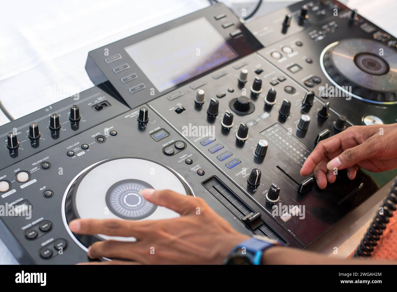 Close-up of a dj operating Sound mixer on a table Stock Photo - Alamy