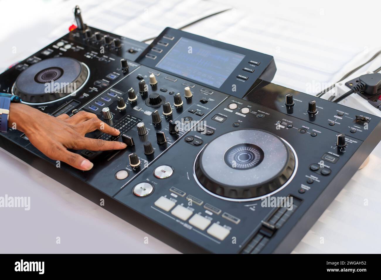 Close-up of a dj operating Sound mixer on a table Stock Photo - Alamy
