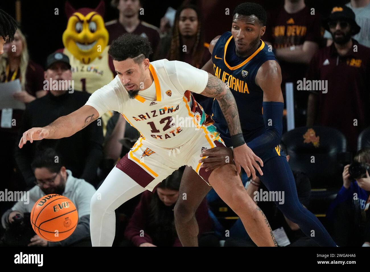 Arizona State guard Jose Perez (12) keeps the ball away from California ...
