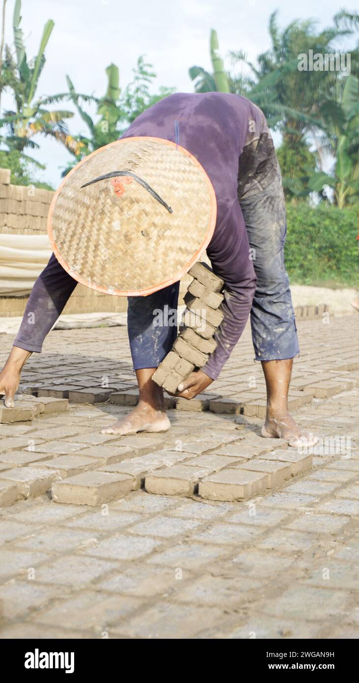 Brick craftsmen working using traditional methods in Indonesia Stock ...