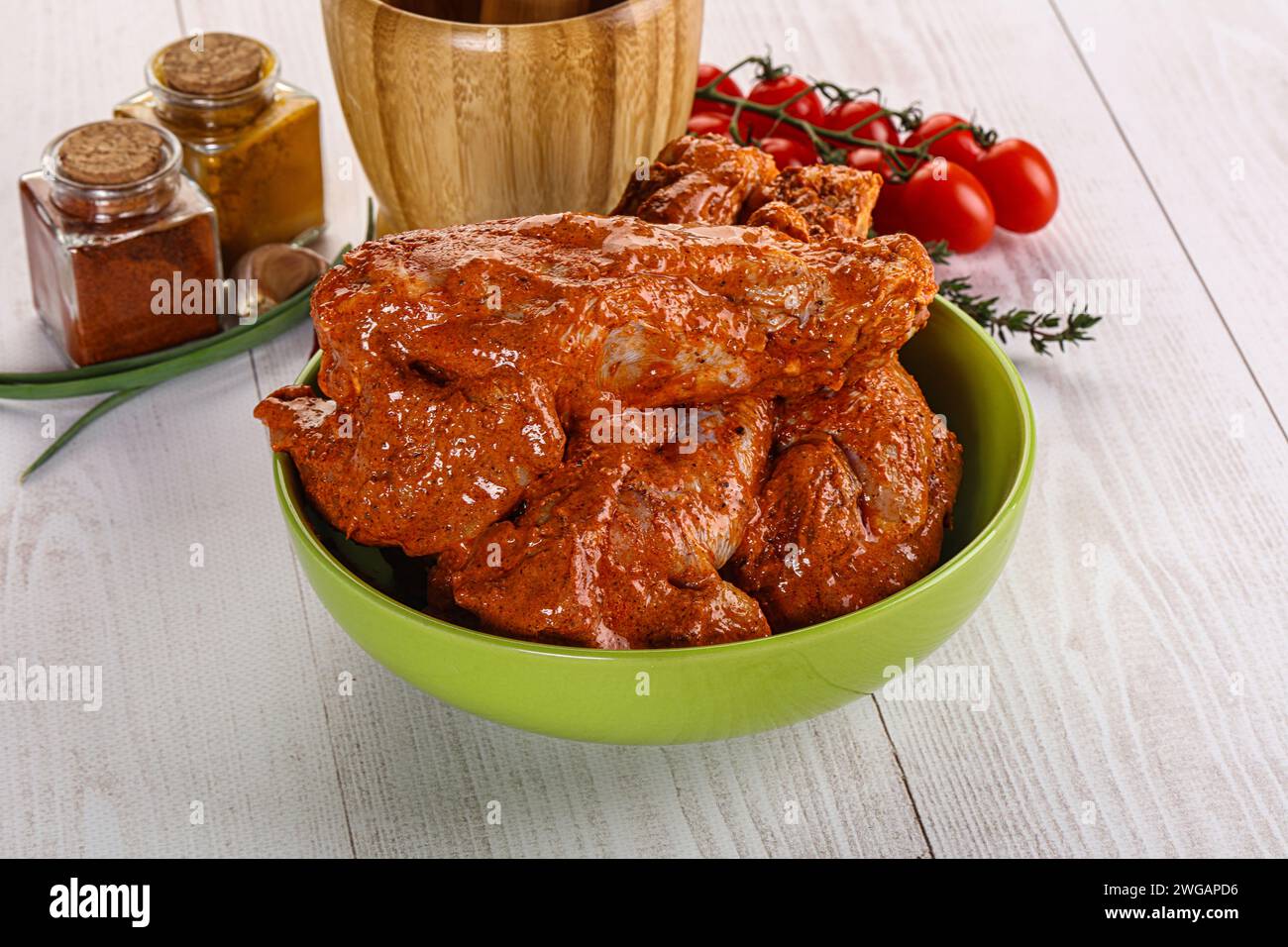 Raw turkey shoulder wing in Indian tandoori marinade spices Stock Photo ...