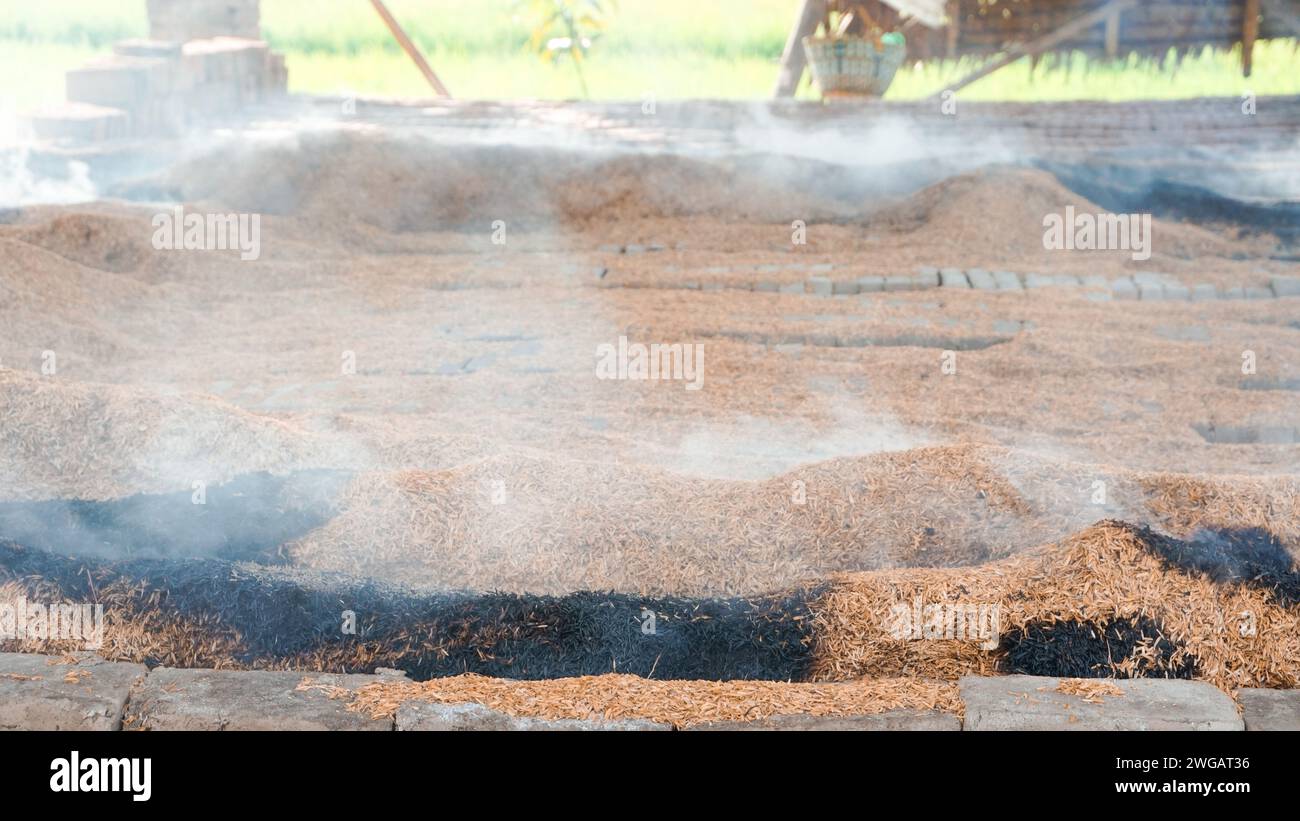 brick burning using dry husks somewhere in Indonesia Stock Photo - Alamy
