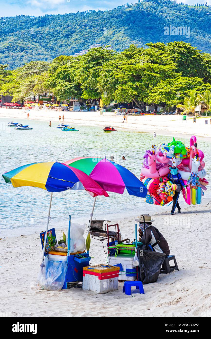 Vendor and umbrella shade on Chaweng beach, Ko Samui, Thailand Stock ...