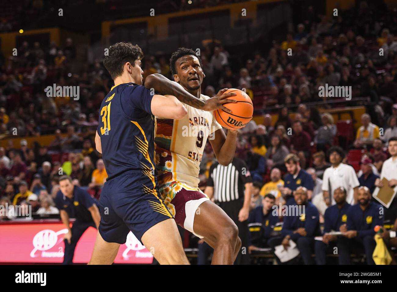 Arizona State Sun Devils center Shawn Phillips Jr. (9) drives toward ...