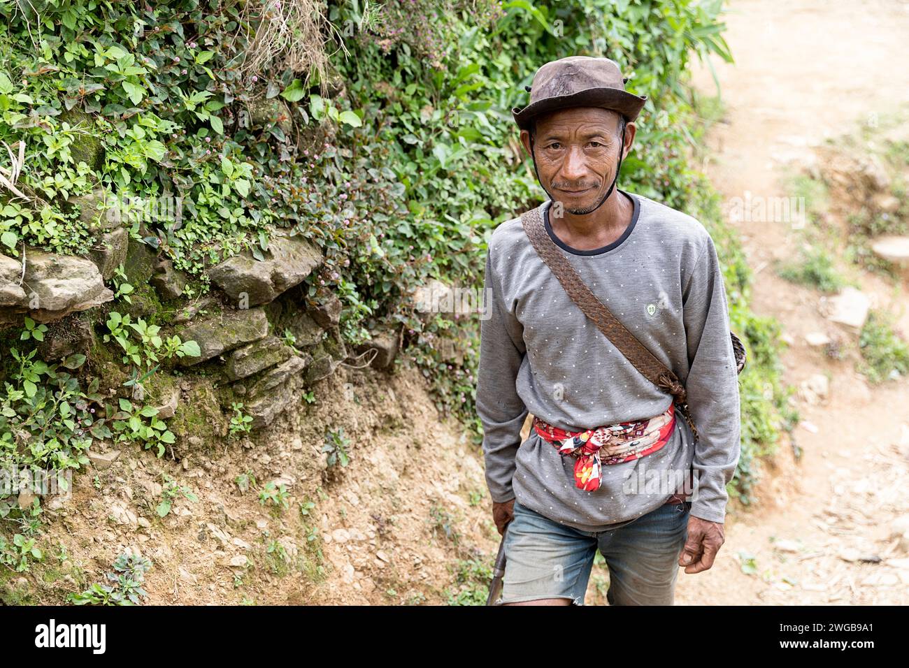 A Man from Wancho Naga tribe near Wakka village in the mountains close ...