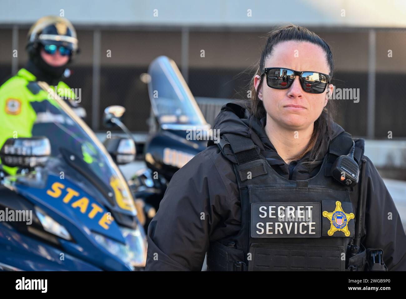 United States Secret Service agent secures the motorcade route as ...