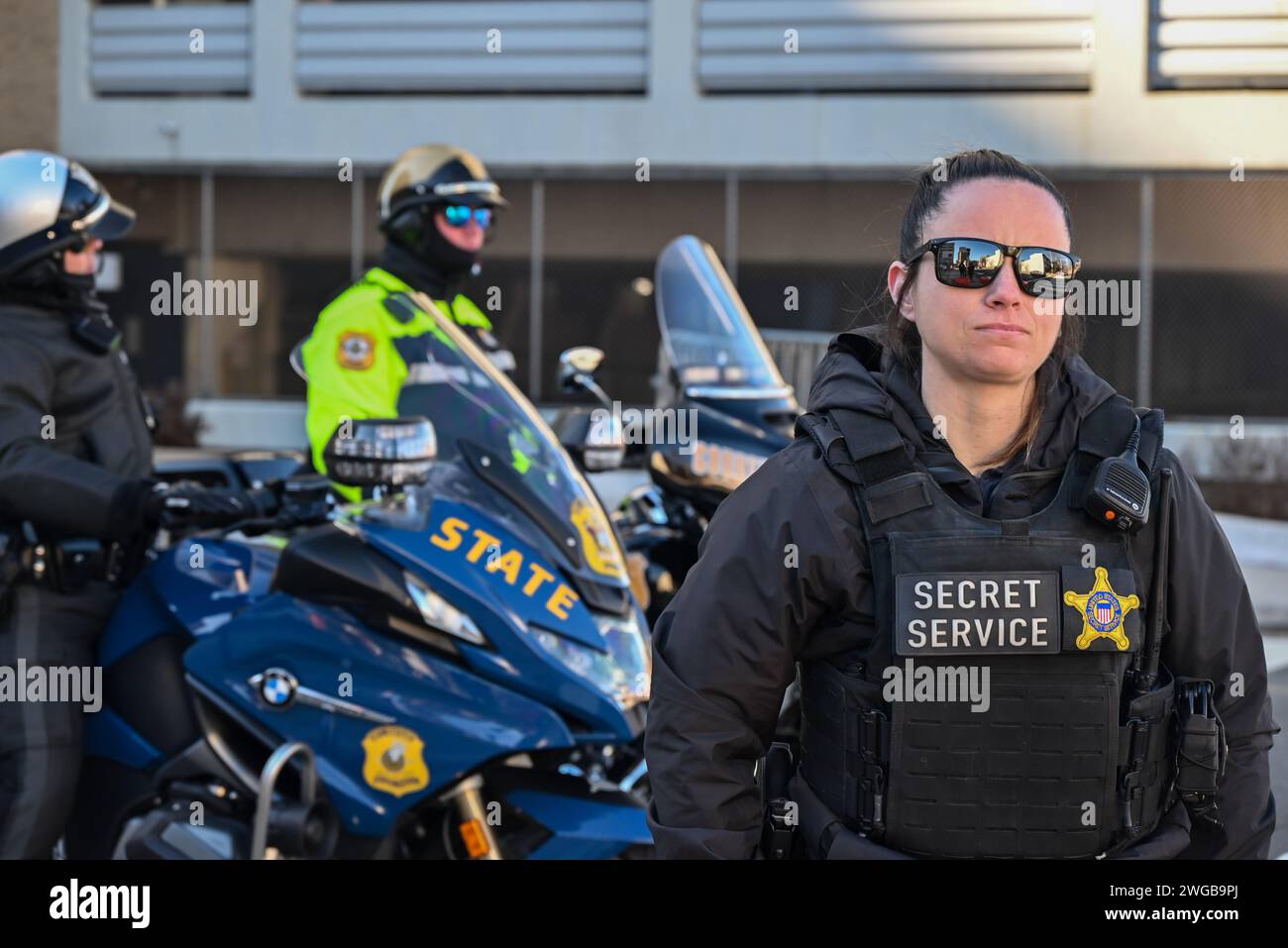 United States Secret Service agent secures the motorcade route as ...
