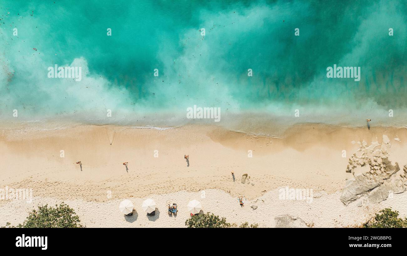Dreamland Beach - Bali sun loungers on the beach people under shade ...