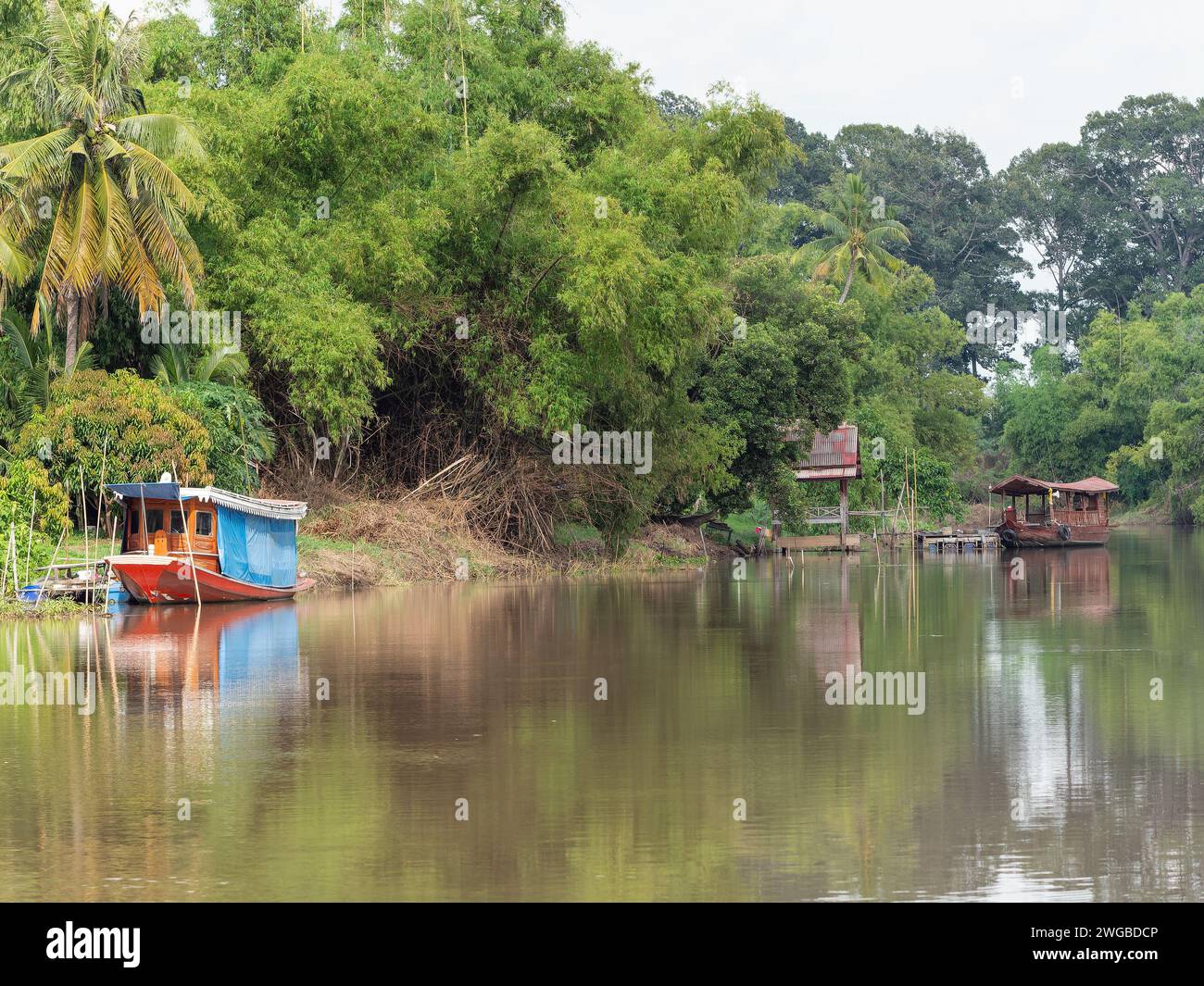 Two traditional, wooden boats on Tha Chin River at Sam Chuk, Suphanburi ...
