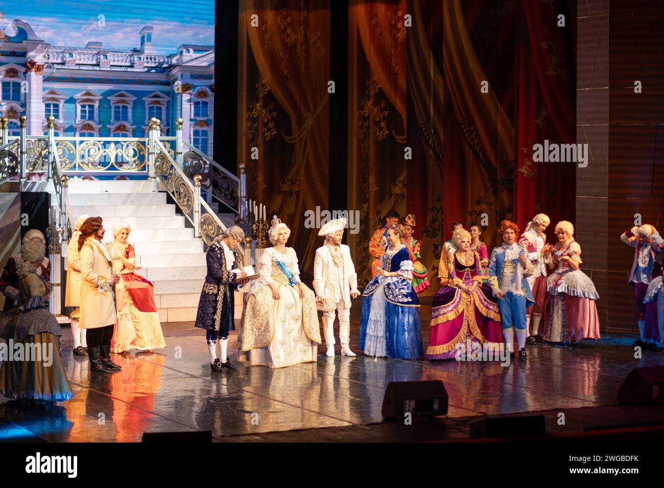 Actresses and actors acting and singing in the musical The Blue Cameo ...