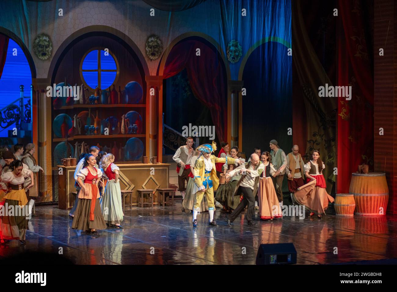 Actresses and actors acting and singing in the musical The Blue Cameo ...